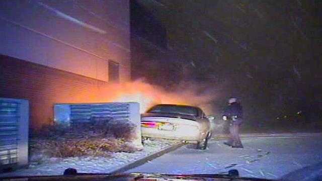 Photos: Officer pulls man from burning car