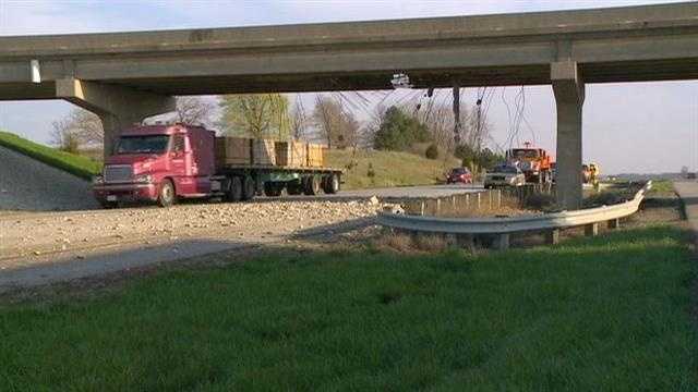 Photos: Bridge torn apart in backhoe crash