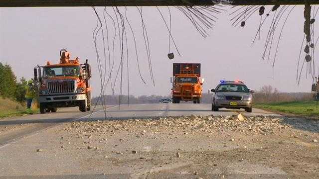 Photos: Bridge torn apart in backhoe crash