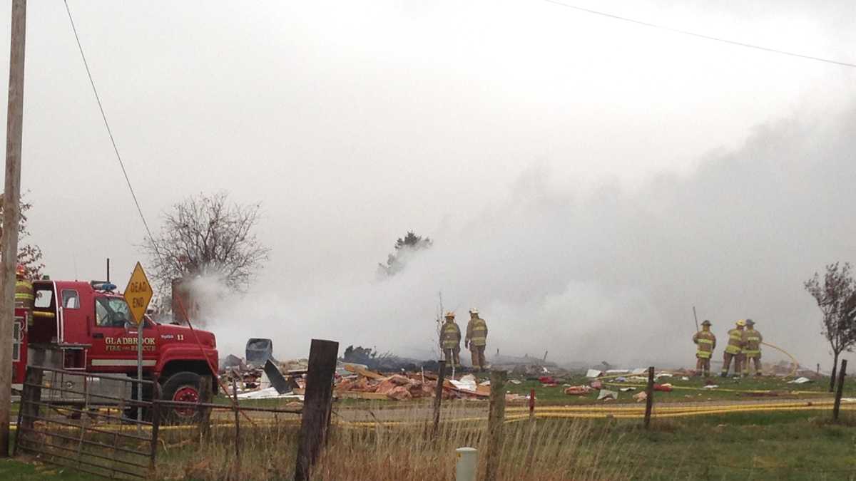 Photos: Explosion, fire level house