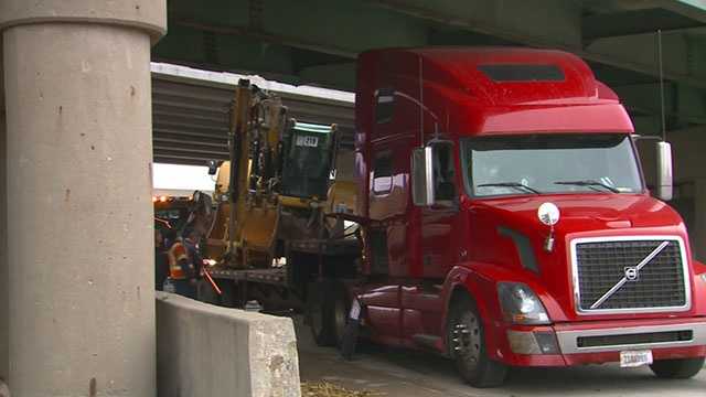 Photos: Backhoe hits interstate overpass