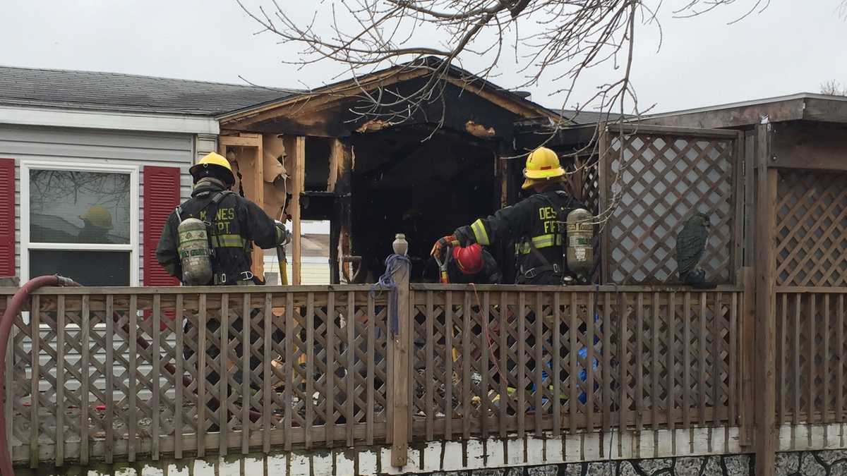 Firefighters report fire shooting out front windows