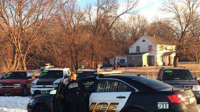 Police surround home after reports of 2 men fighting