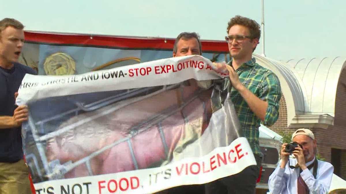 Protesters hop on Soapbox stage during Christie’s speech