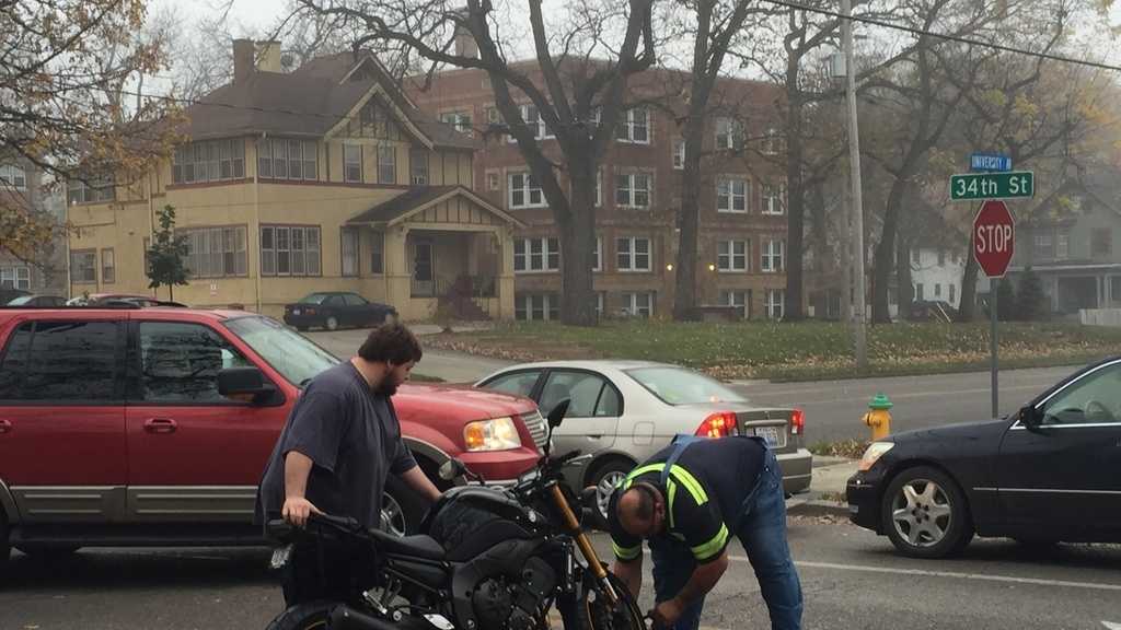Motorcycle slides across road trying to avoid crash