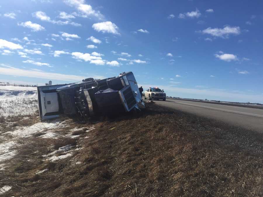 PHOTOS: Semi rollover crash blamed on high winds