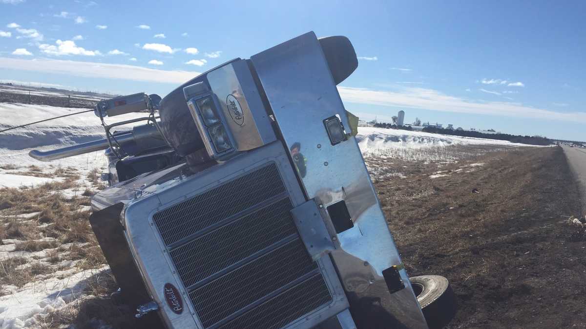 PHOTOS: Semi rollover crash blamed on high winds