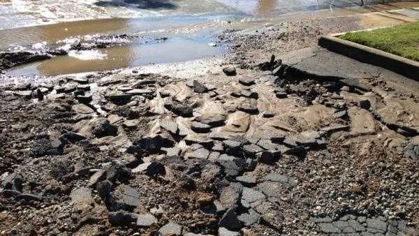 Photos: Water boils out of ground, causes morning delays