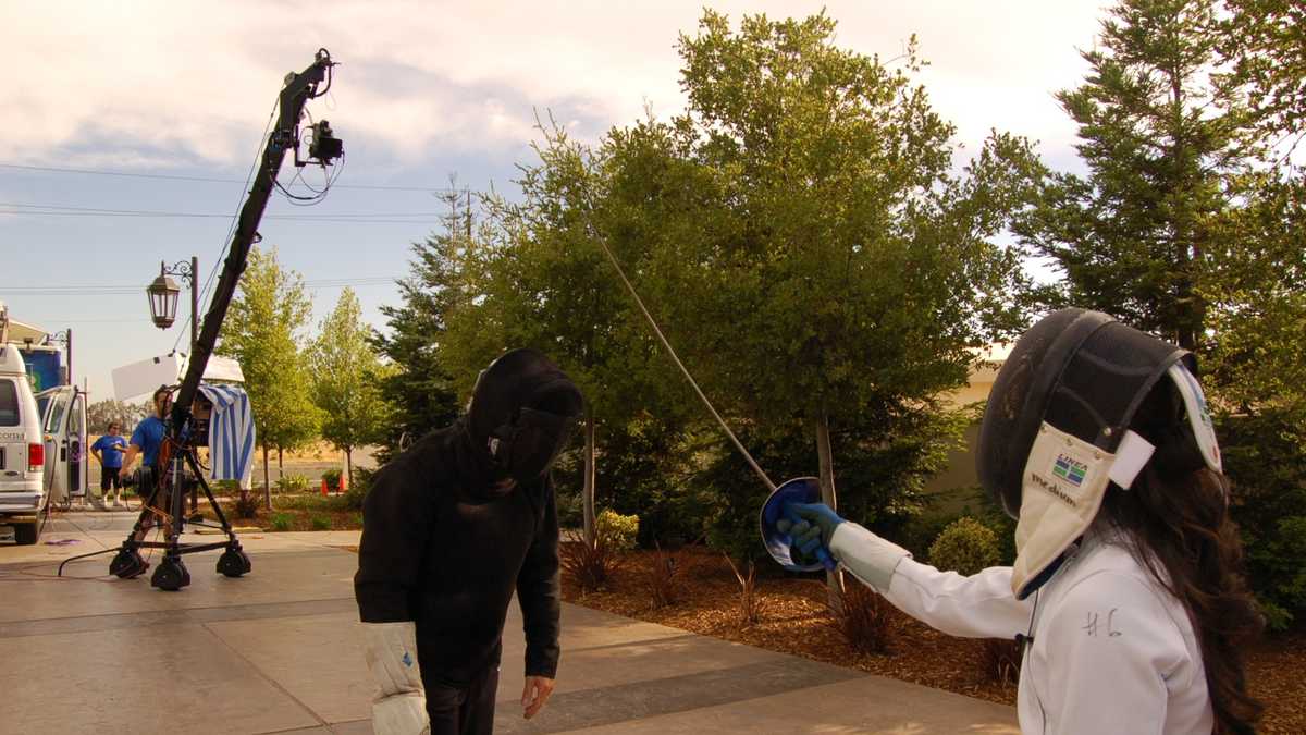 Photos: SWORDS! Sabre fencers invade the Olympic Zone