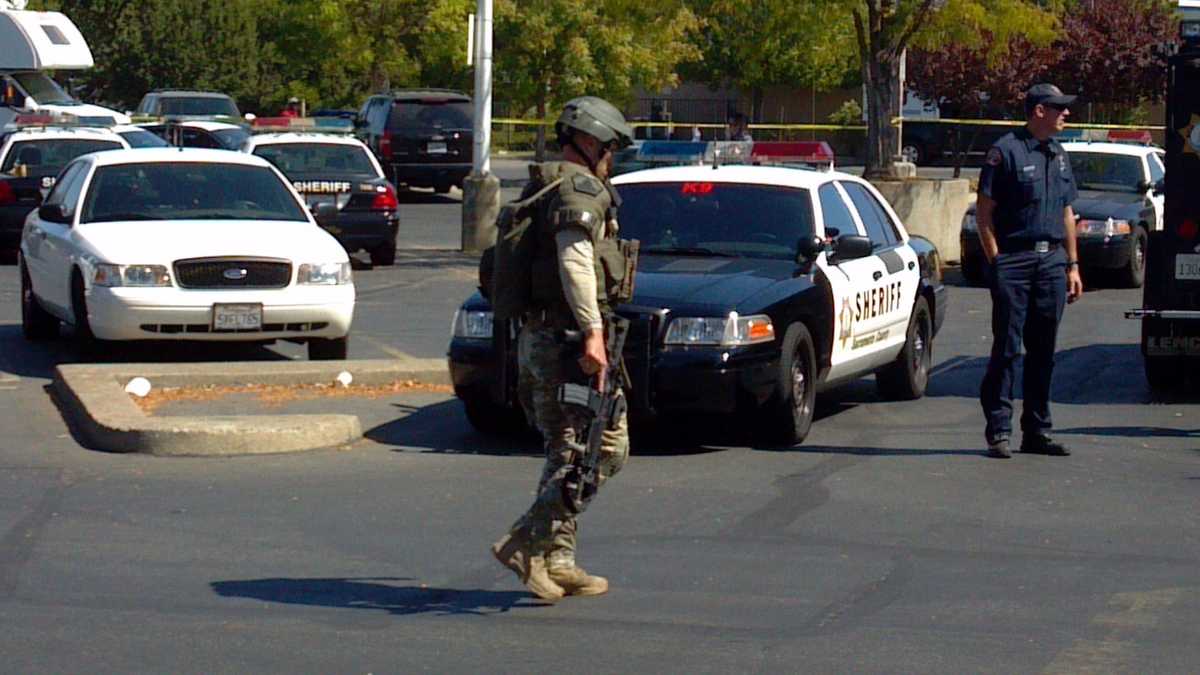 Photos from the field: Officials seek armed person
