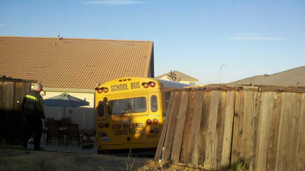 School bus rolls into Auburn backyard