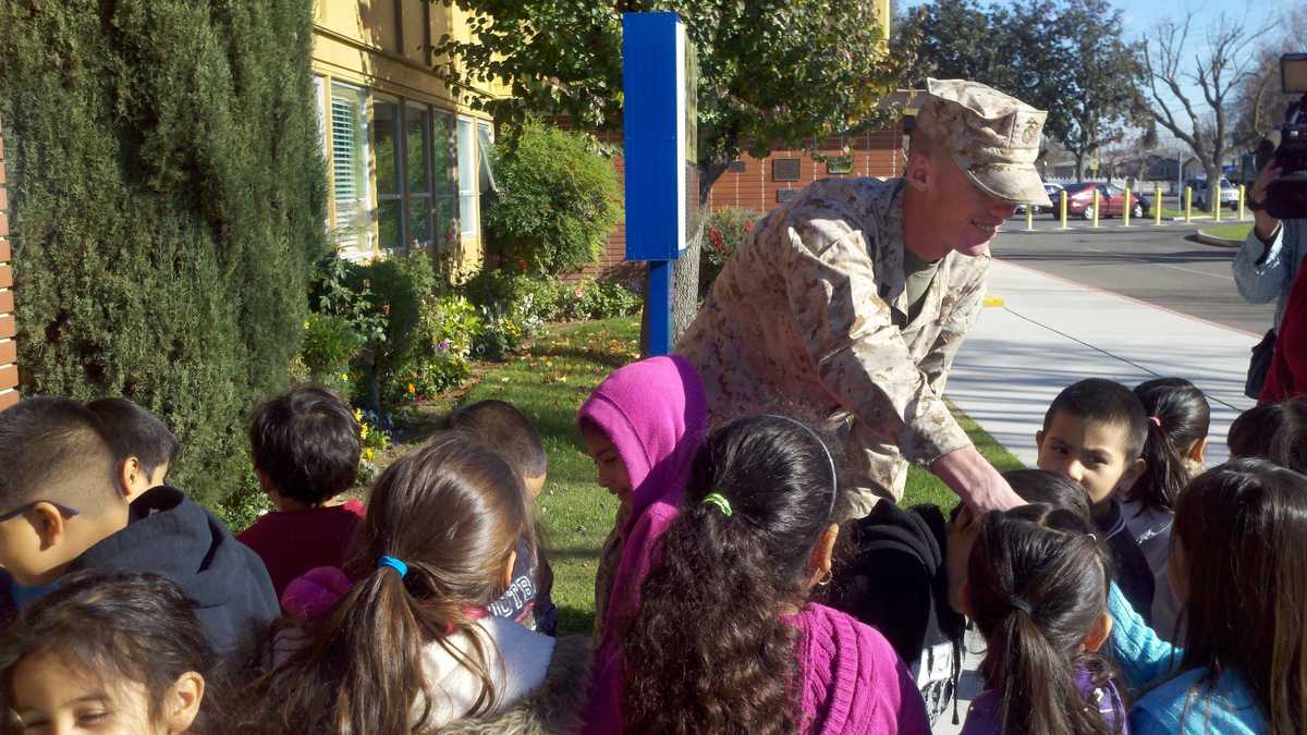 Photos: Marine stands ground outside elementary school