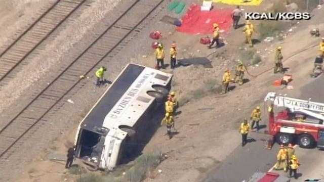 Photos: Tour bus overturns on Southern California freeway