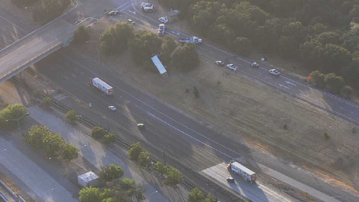Photos: Big rig driver rescued from rollover crash