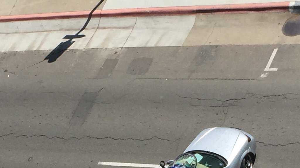 PHOTOS: Person barricaded in car blocks road in front of Capitol