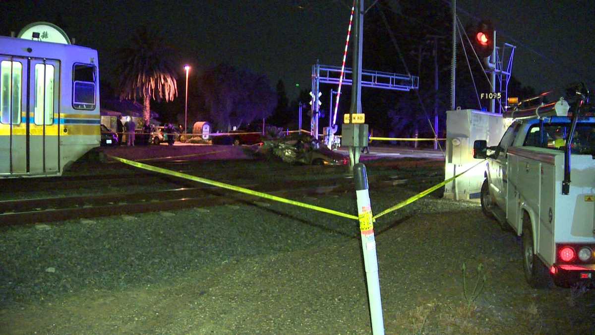 RT: Man drives around crossing gate, hit by train