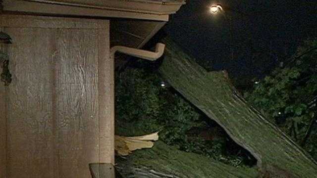 Giant tree falls on home during storms
