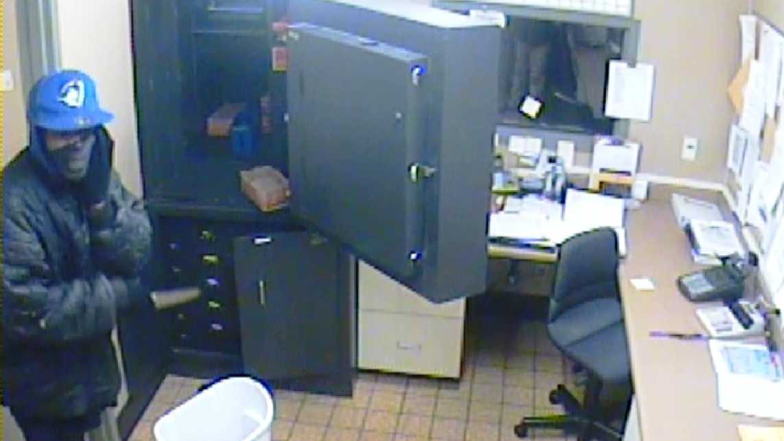 Robber caught on camera taking money from store safe