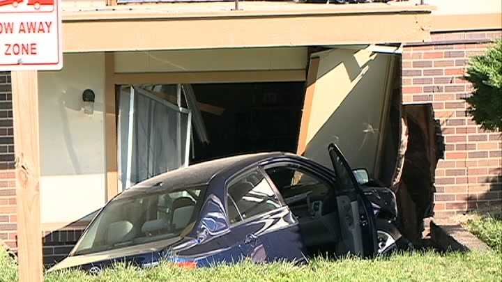 Photos: Driver rams car into apartment building