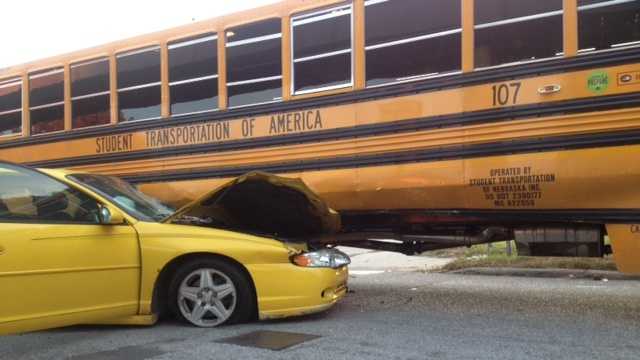 Photos: 1 hurt in car vs. school bus crash
