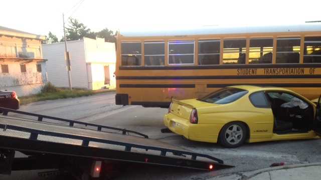 Photos: 1 hurt in car vs. school bus crash