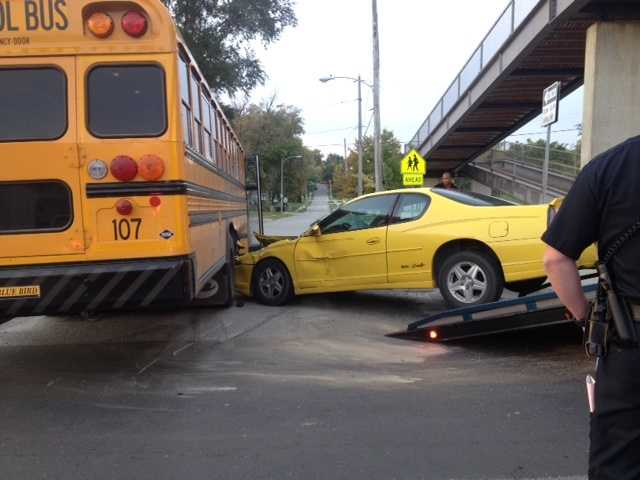 Photos: 1 hurt in car vs. school bus crash
