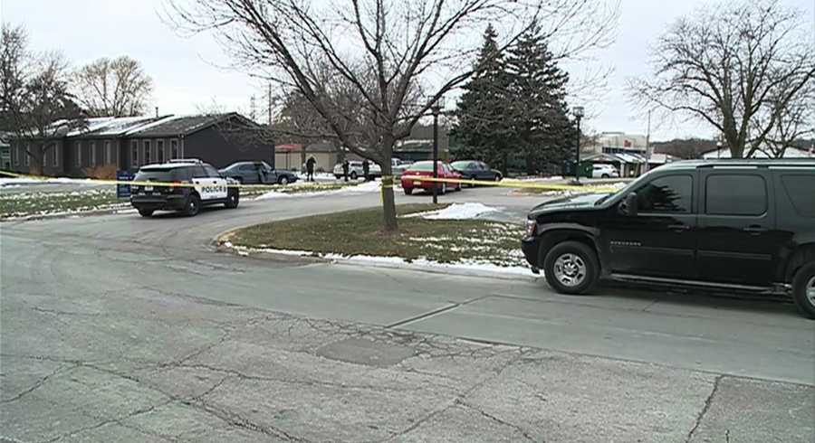 Photos: Police investigate bank robbery, shooting
