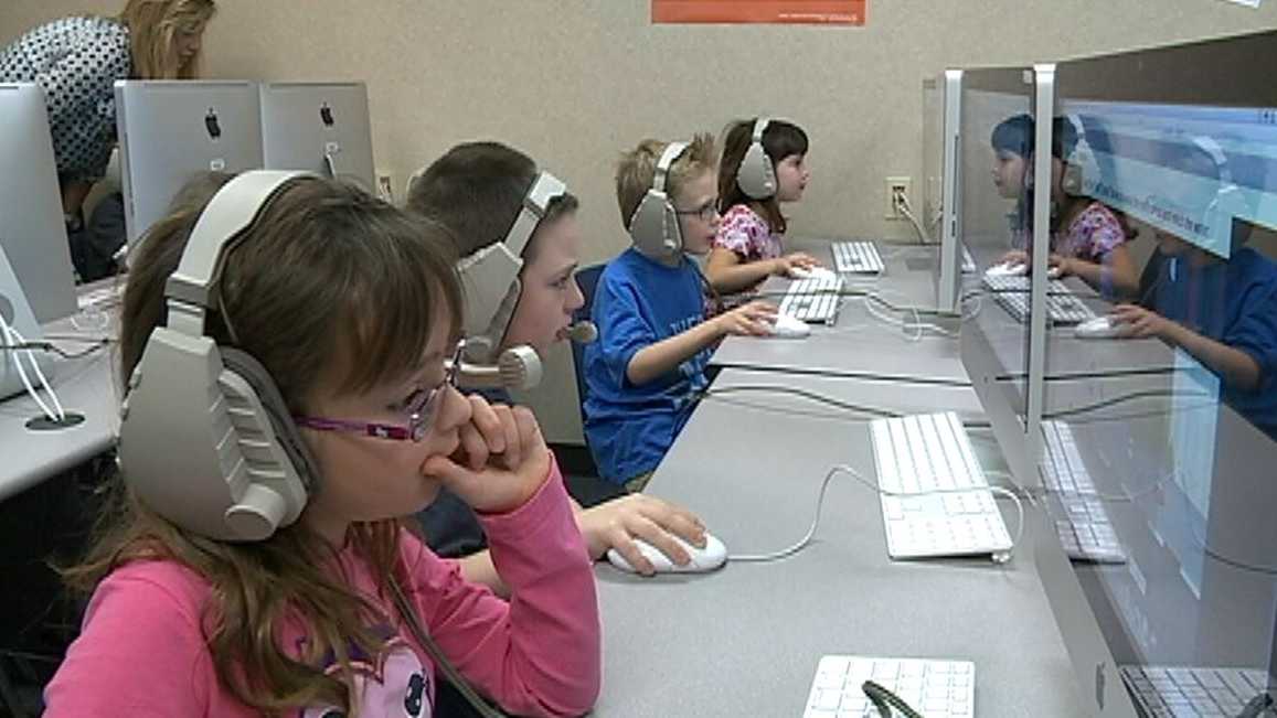 Local elementary students learning to code