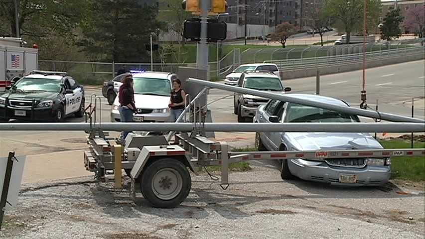 Photos: Car crashes into pole being installed
