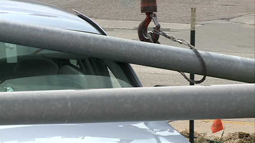 Photos: Car crashes into pole being installed