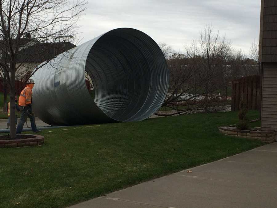 PHOTOS: Giant culvert almost hits Omaha home