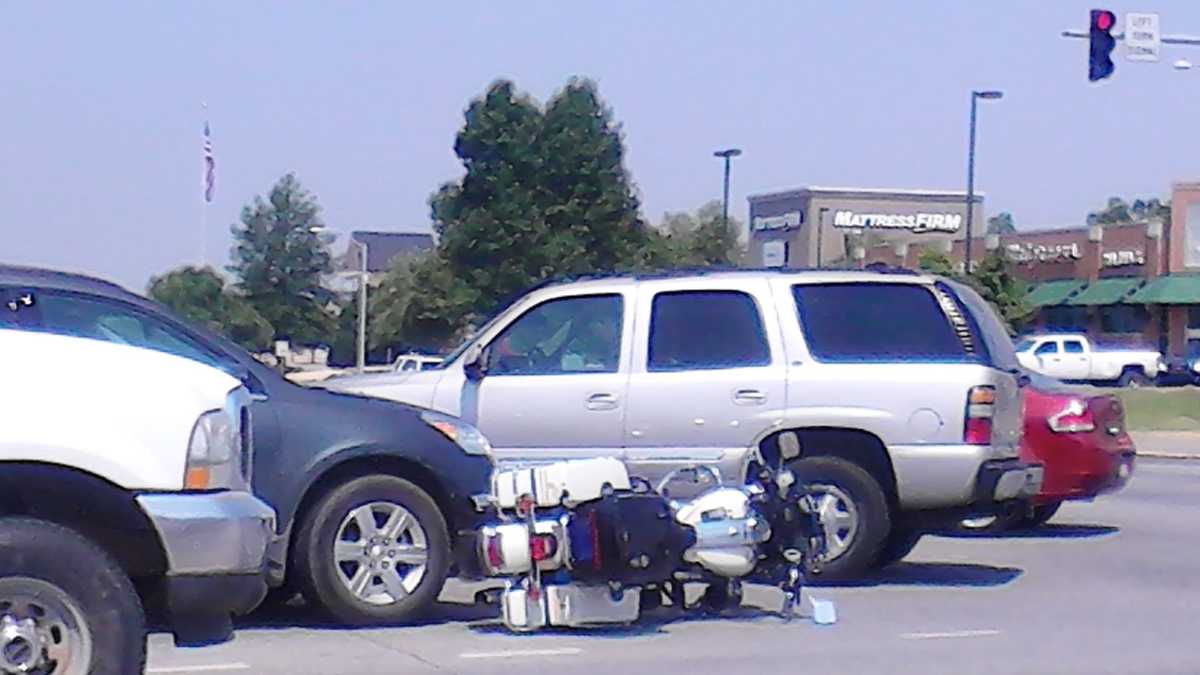 Police: Motorcycle officer hit by car