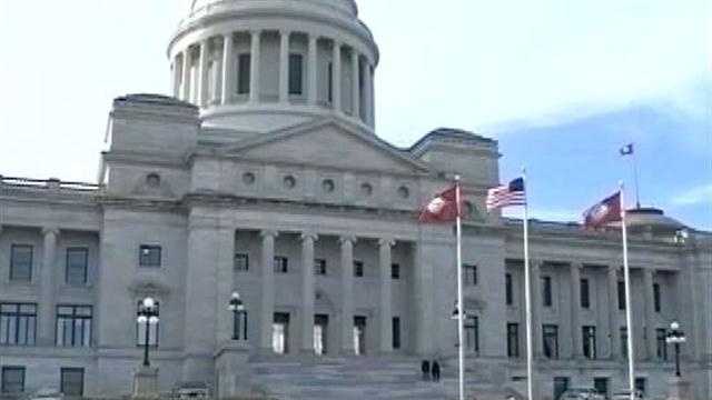 Beebe signs Medicaid private option bill