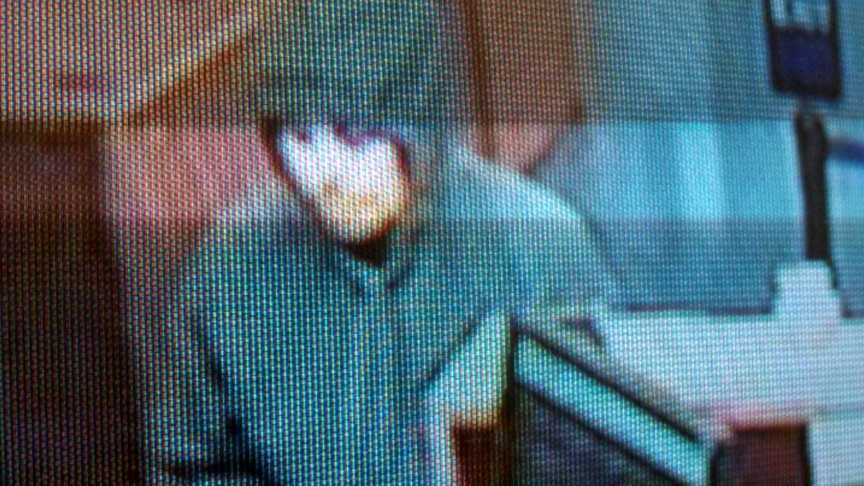 Police search for woman who robbed Alma bank