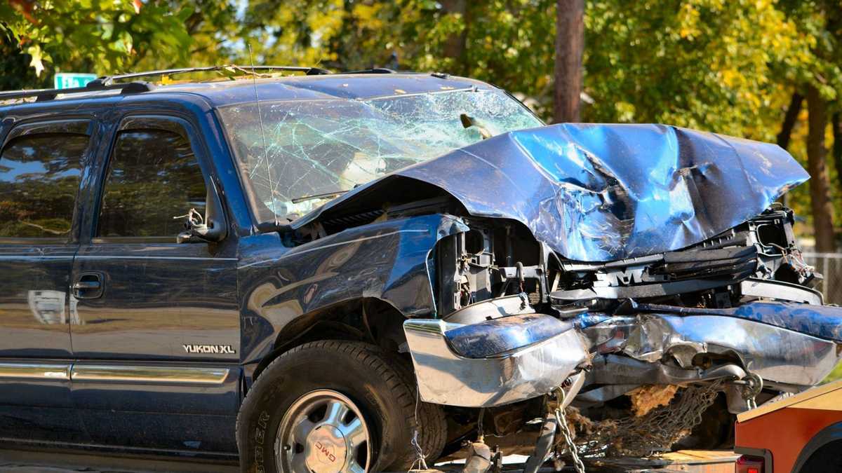 Photos: Car crashes through fence, into yard