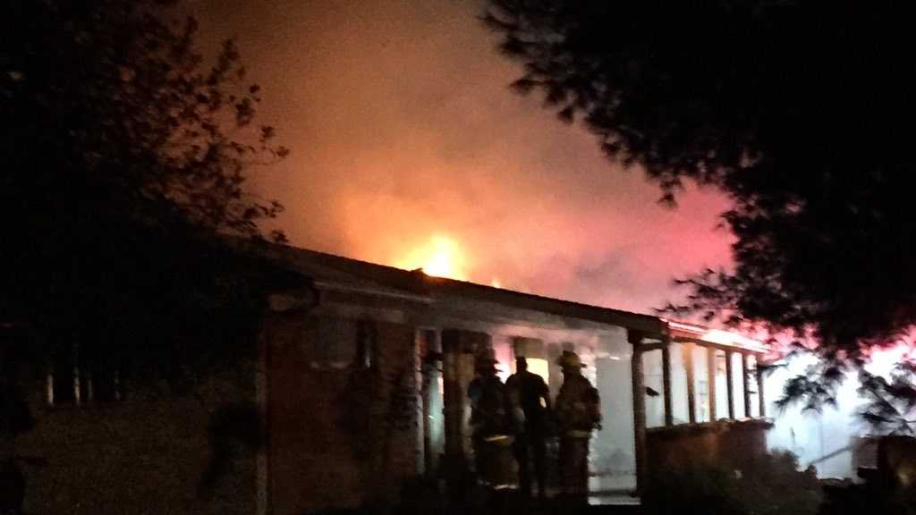 Firefighters battle house fire in Springdale