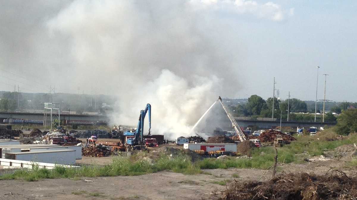 Tire fire burns in scrapyard off Interstate 435