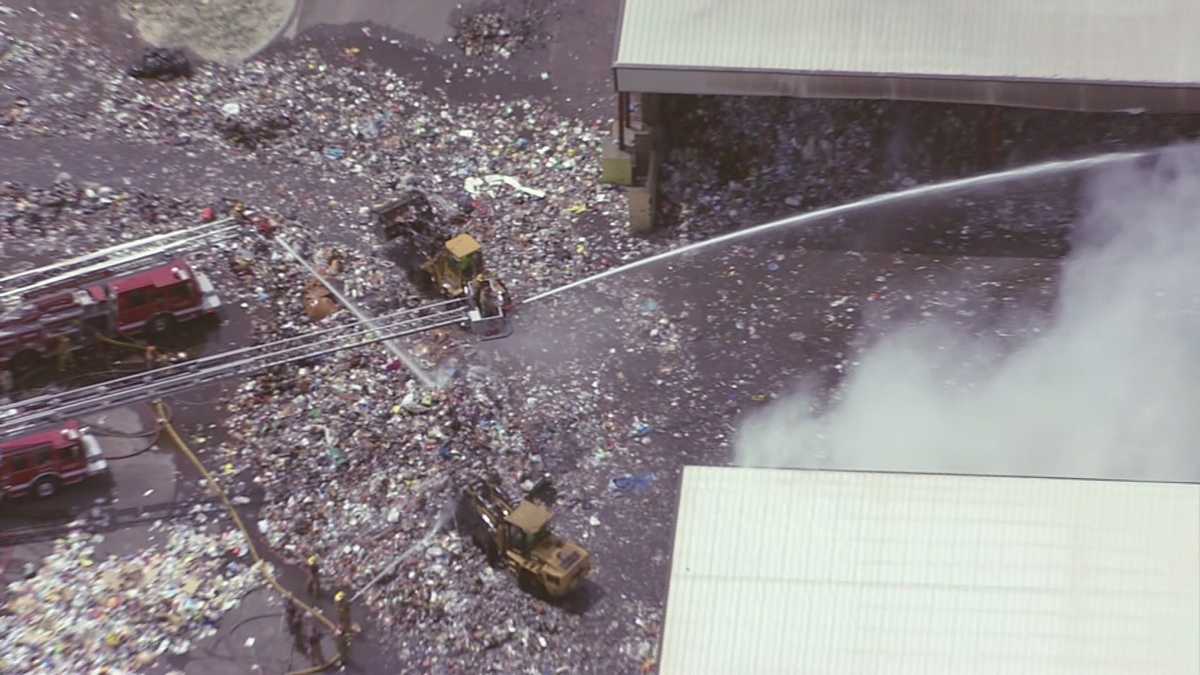 Images: Fire slowly burns at metro recycling plant