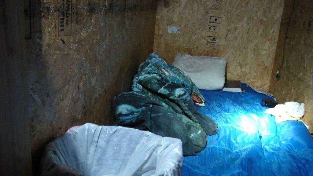 Police release disturbing photos of box where woman held captive