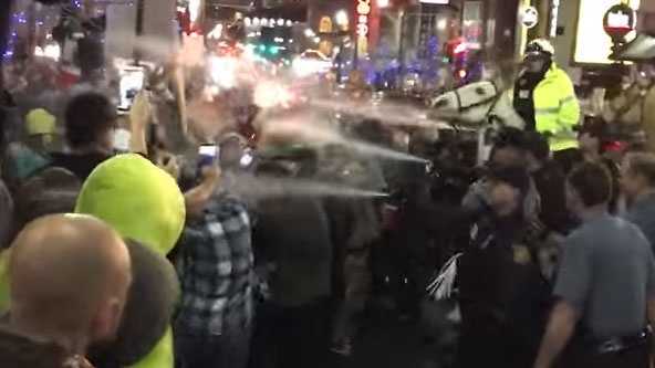 Police make arrests, use pepper spray to control crowds outside Trump rally