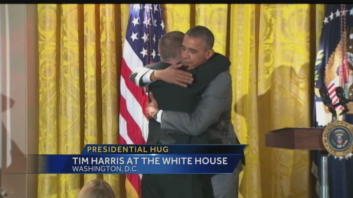 Tim Harris doles out famous hug to President Obama