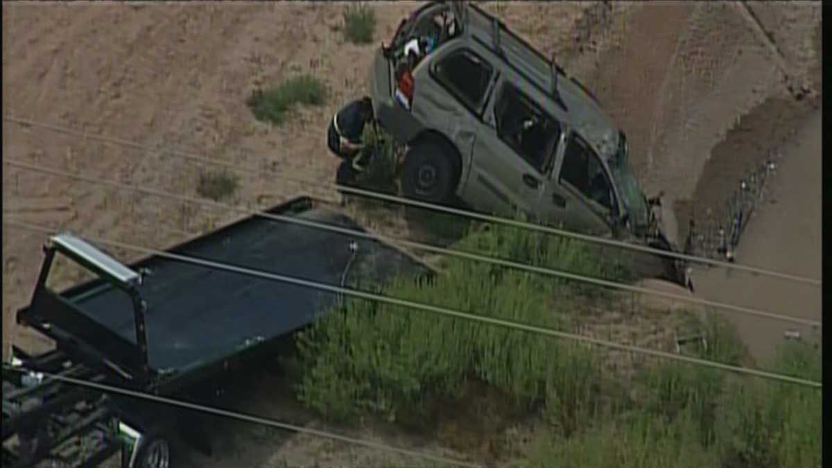 PHOTOS: Minivan crashes into ditch