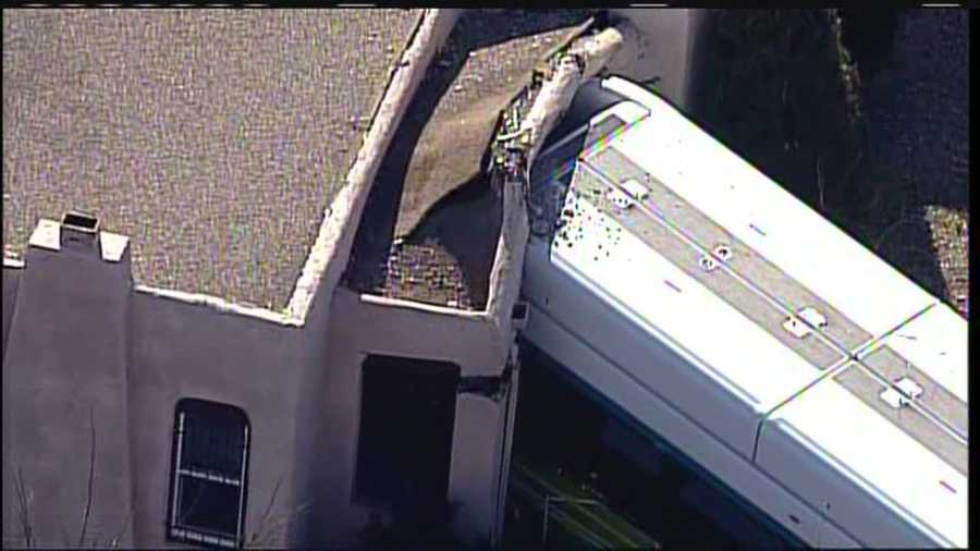Photos: ABQ bus slams into home