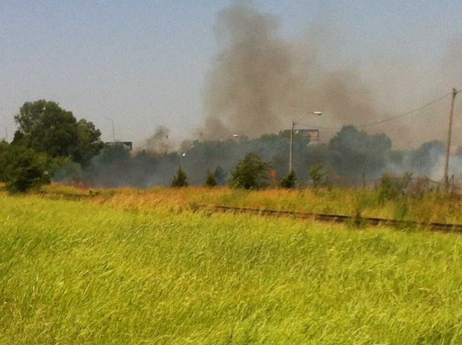 Photos: Crews battle grass fire near airport