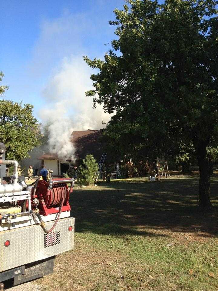 Photos: Fire burns two-story home