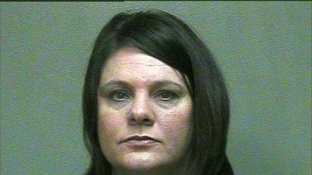 Edmond mom charged with embezzlement turns self in