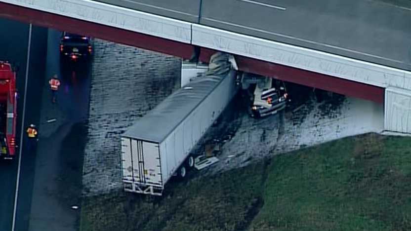 Semi-truck stuck under bridge on NB I-35 in Norman