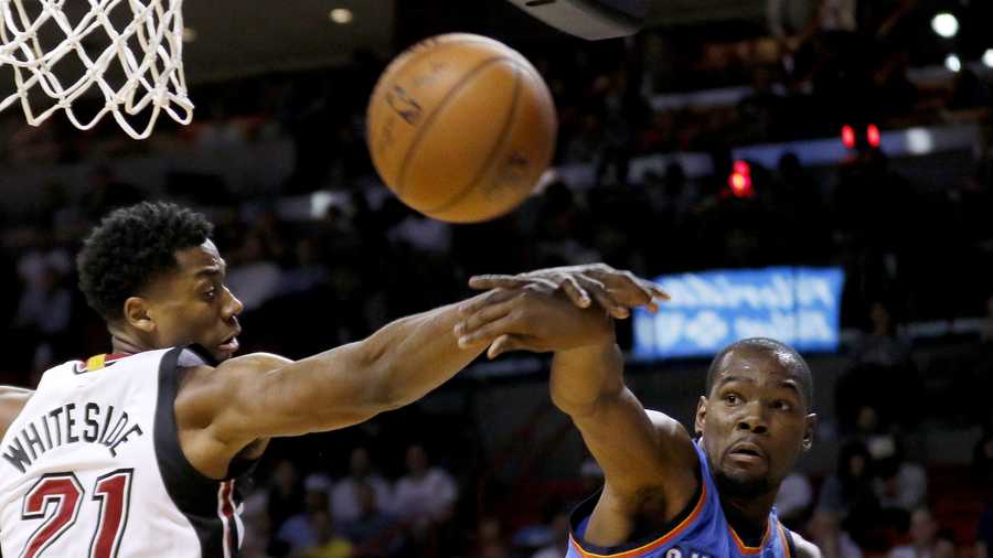 Wade's 28 lifts Miami over OKC in wild game, 97-95
