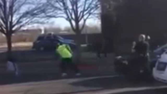 Edmond police officer plays all-time QB in pickup game with children