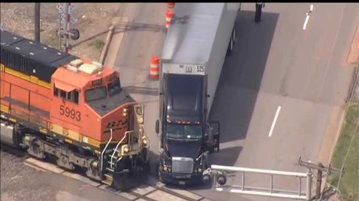 Train hits truck near busy Edmond intersection
